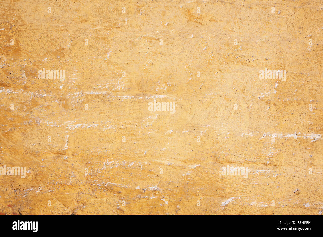 abstract pattern of part of old ochre painted brick wall Stock Photo ...