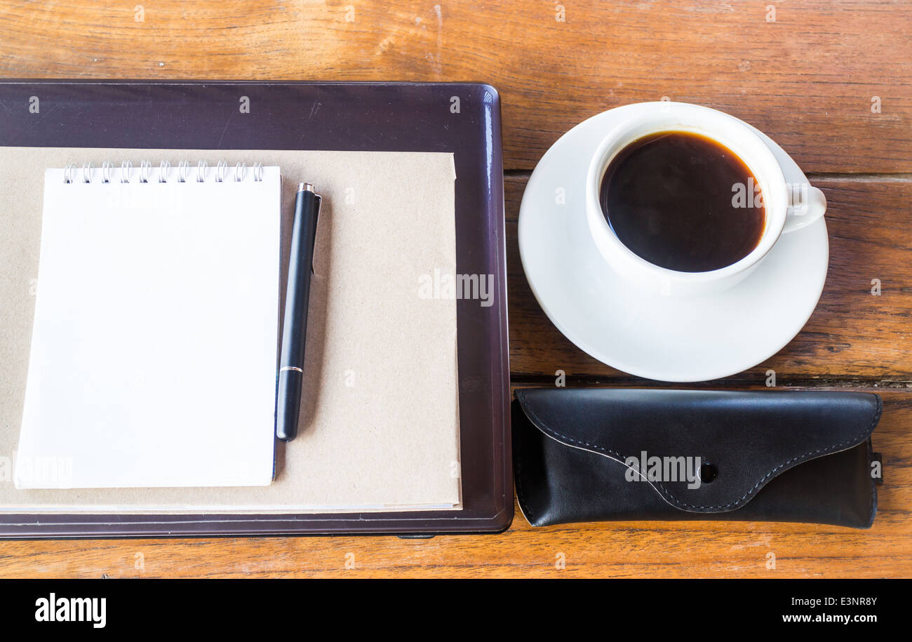 Simple work table with cup of coffee, stock photo Stock Photo - Alamy