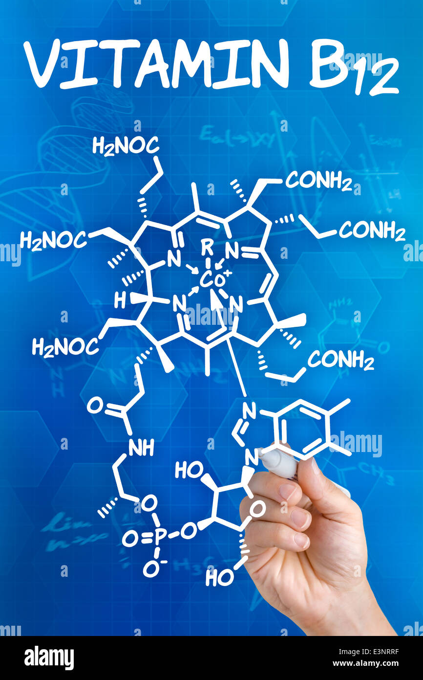 Hand with pen drawing the chemical formula of Vitamin B12 Stock Photo ...