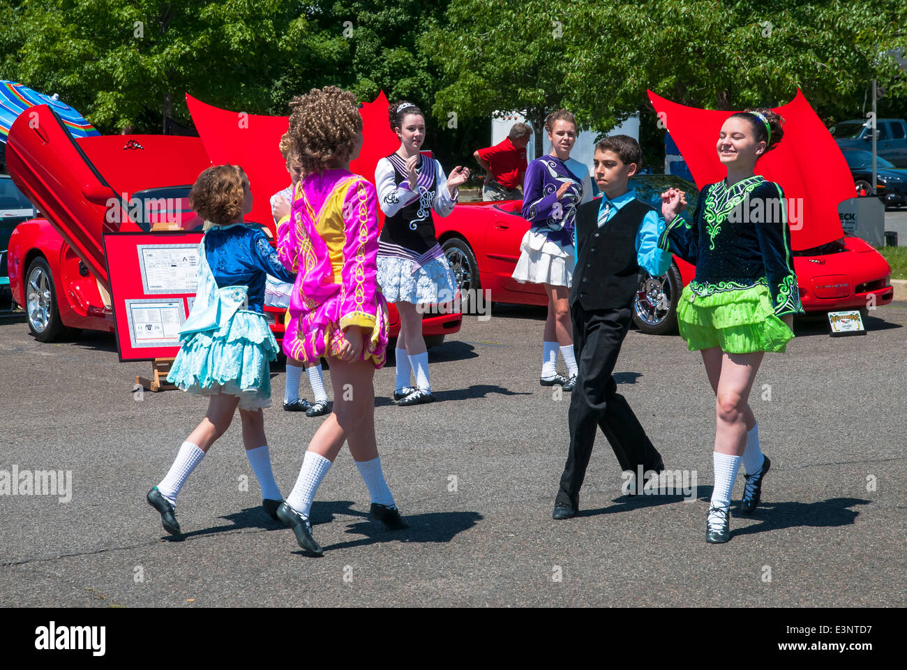 One boy and 3 girls dancing Irish dance to participants and spectators ...