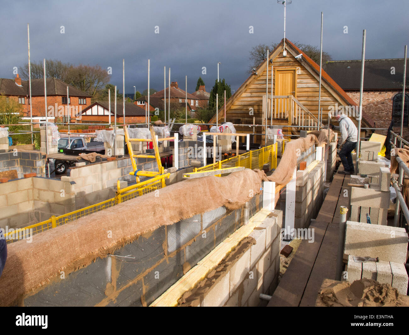 self building house, bricklayer working on first lift scaffolding Stock ...