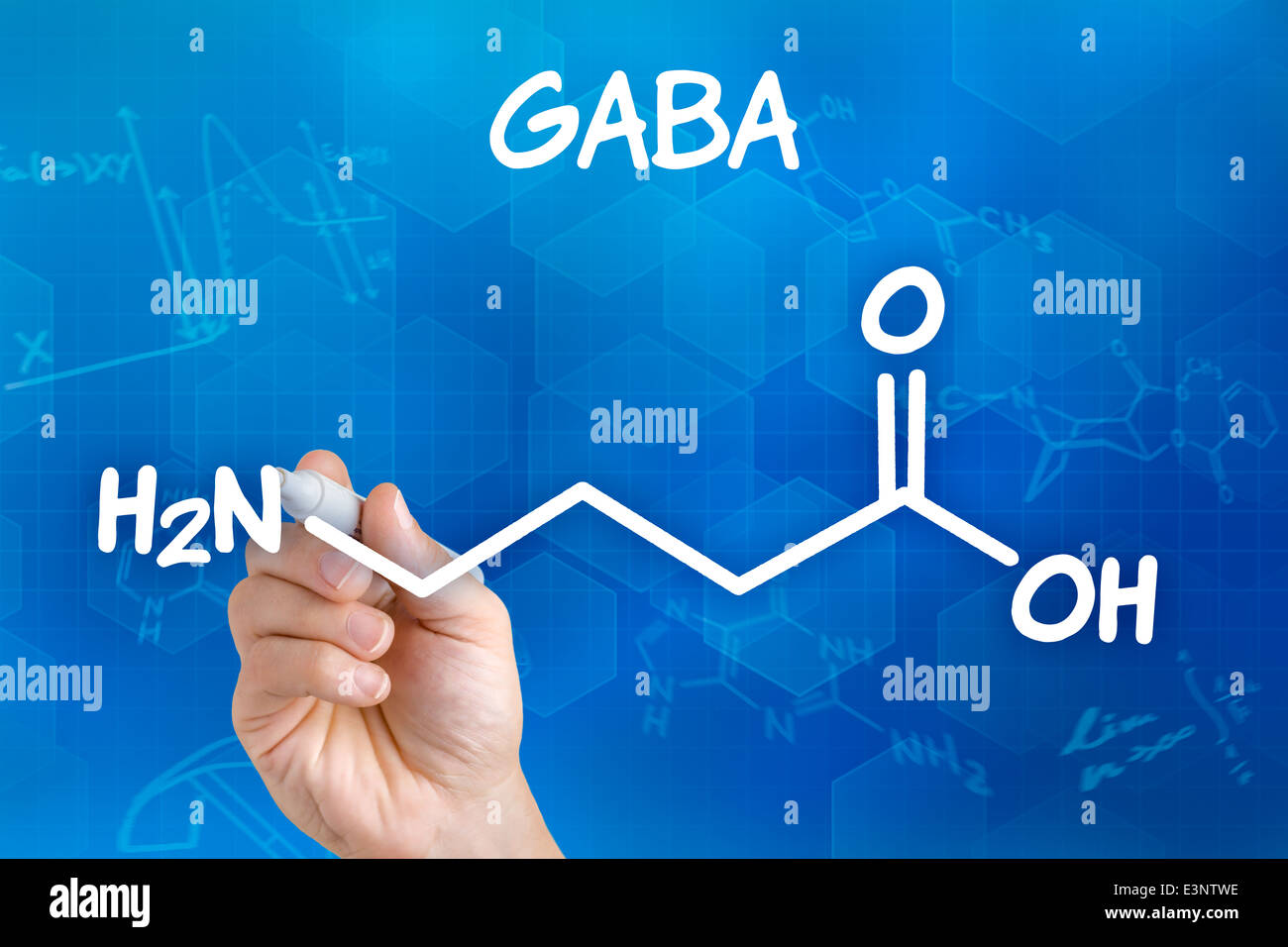 Hand with pen drawing the chemical formula of GABA Stock Photo - Alamy