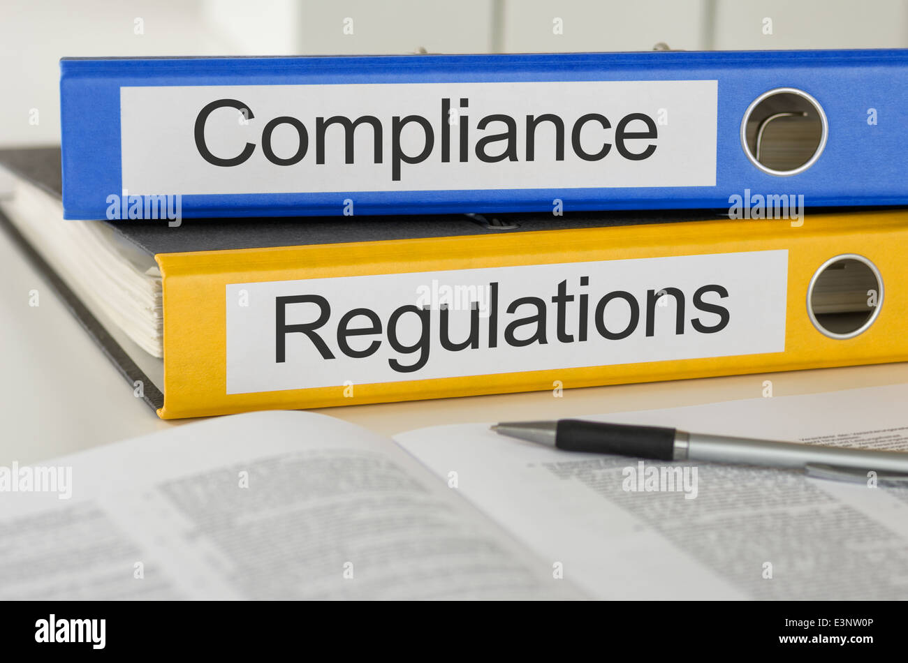 Folders with the label Compliance and Regulations Stock Photo - Alamy