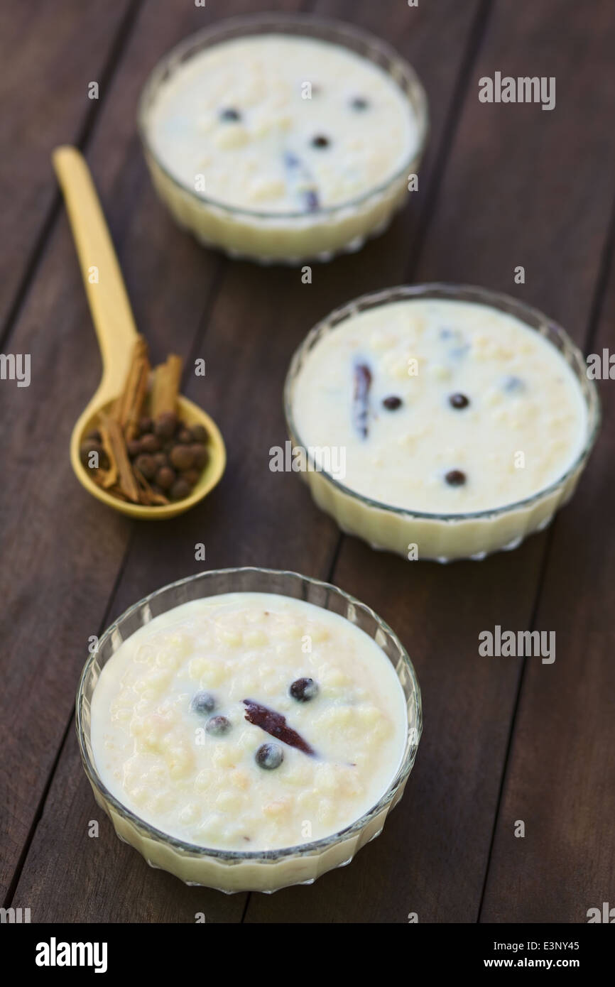 Three glass bowls of the Ecuadorian dessert called morocho (coarsely ...