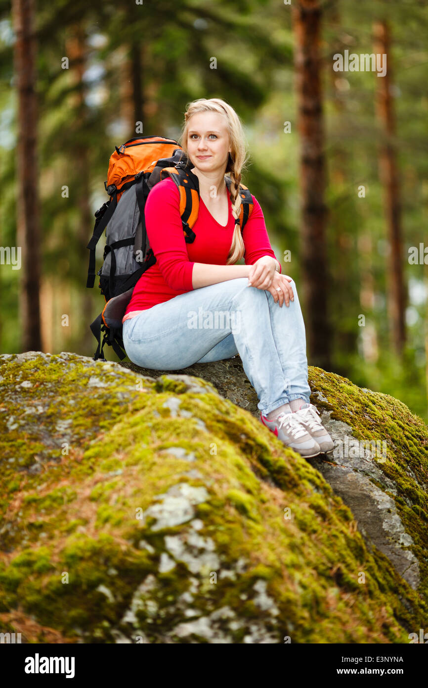 Young beautiful woman hiking in a forest Stock Photo - Alamy