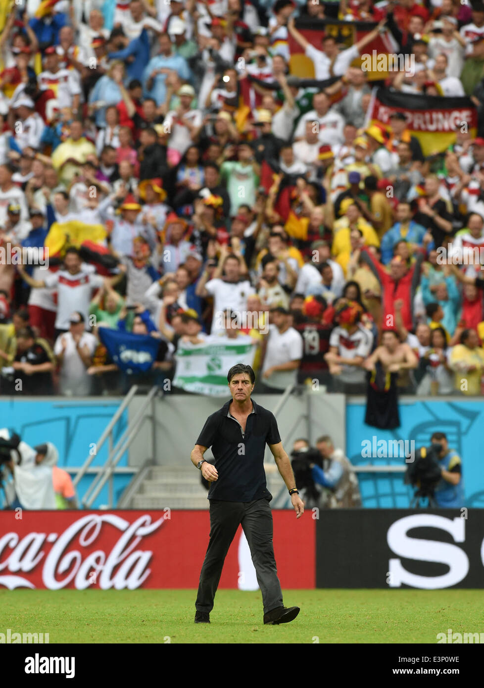 Recife, Brazil. 26th June, 2014. German head coach Joachim Loew walks ...