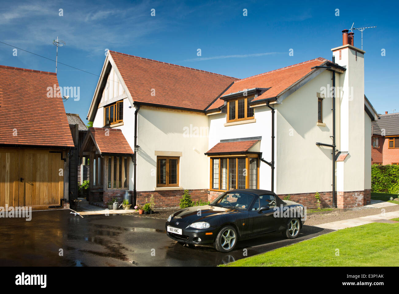 house building, new self built house with Mazda mx5 car parked on newly ...