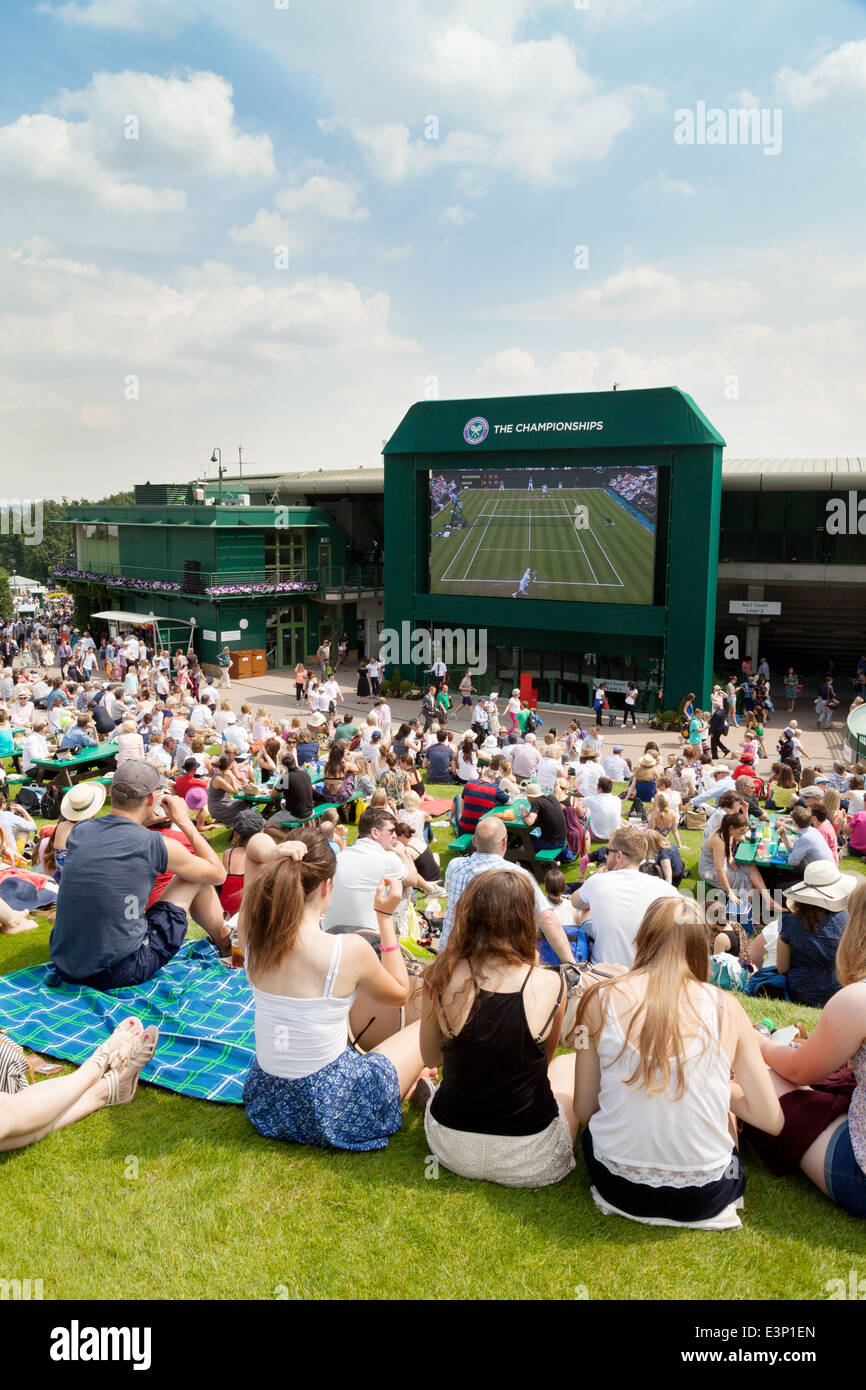 Crowds watching the tennis at Wimbledon from Henman Hill, otherwise ...