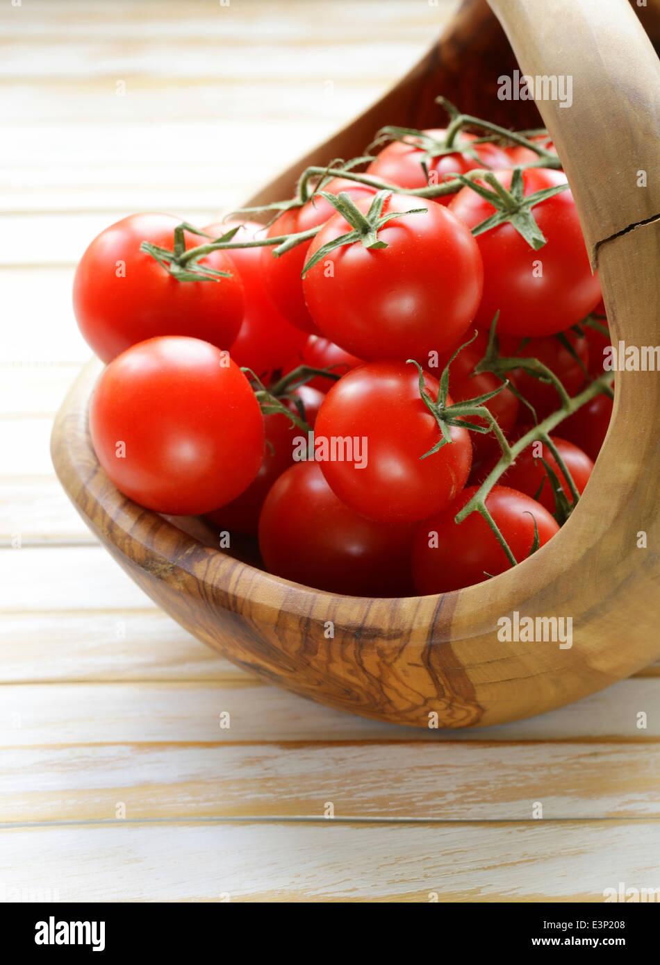 fresh ripe organic tomatoes on a wooden table Stock Photo - Alamy
