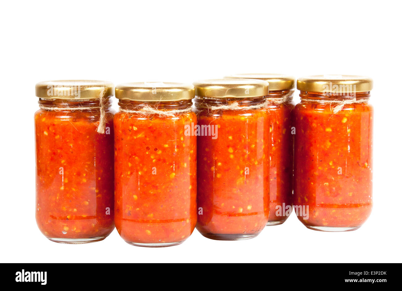 bottles of bright red chili preserve known as Mazavaroo Stock Photo - Alamy
