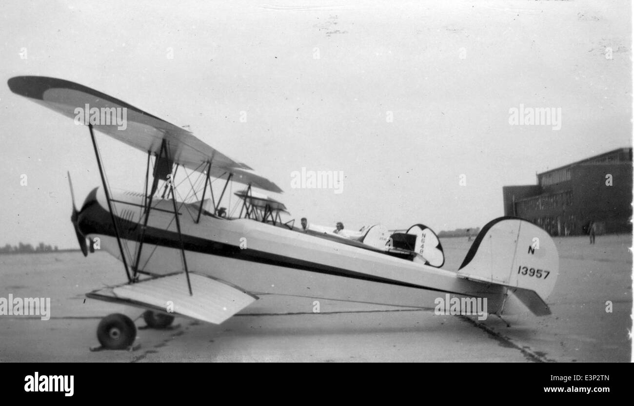 Wiley Post, an aviation legend, is shown with his aircraft, NC13957 ...
