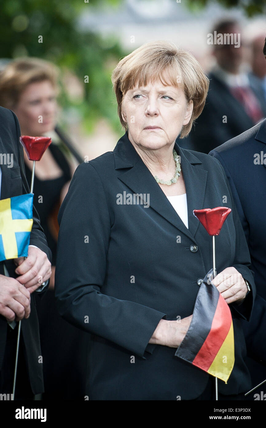 German Chancellor Angela Merkel attends a ceremony marking the ...
