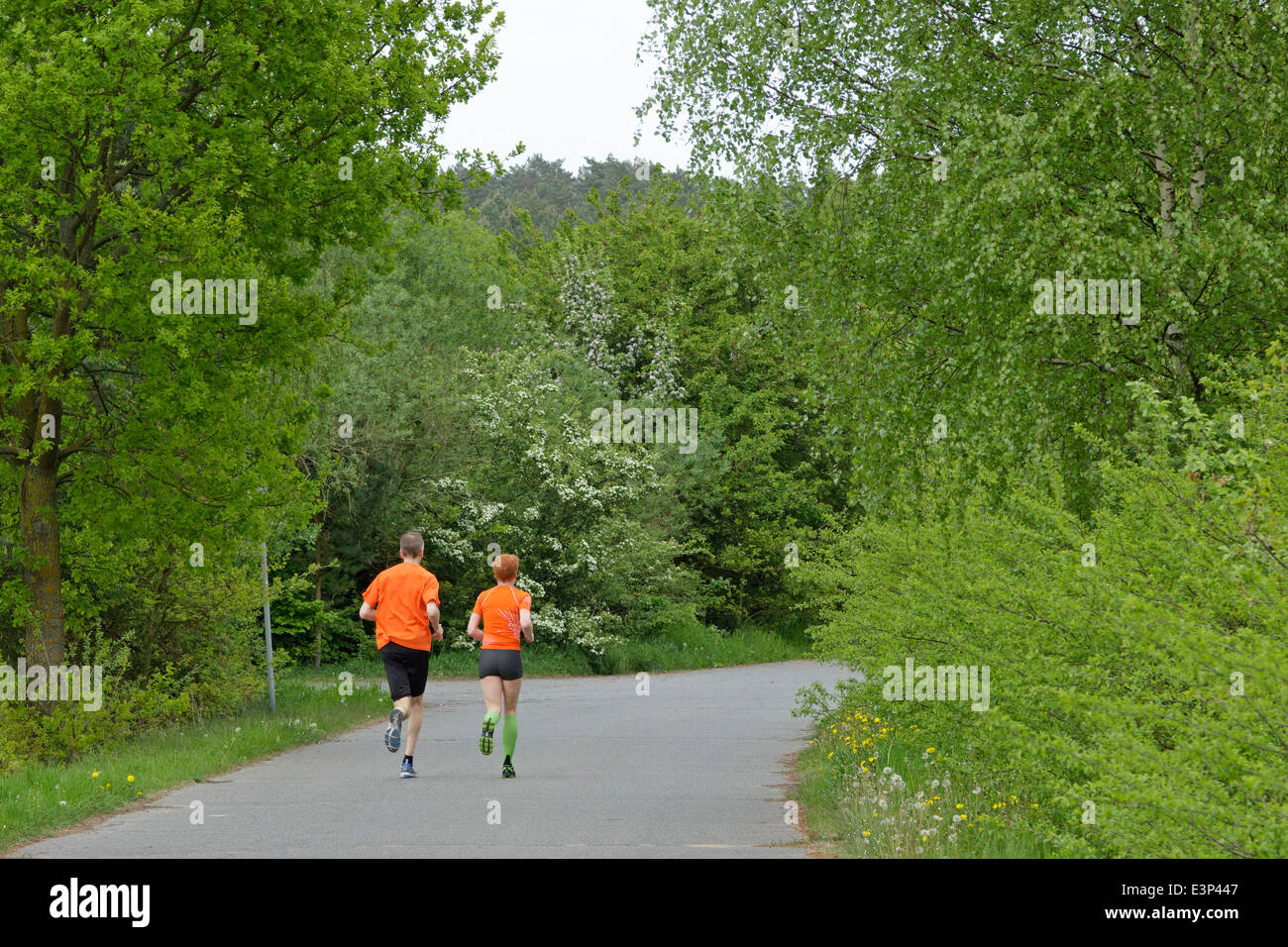 two people jogging Stock Photo - Alamy