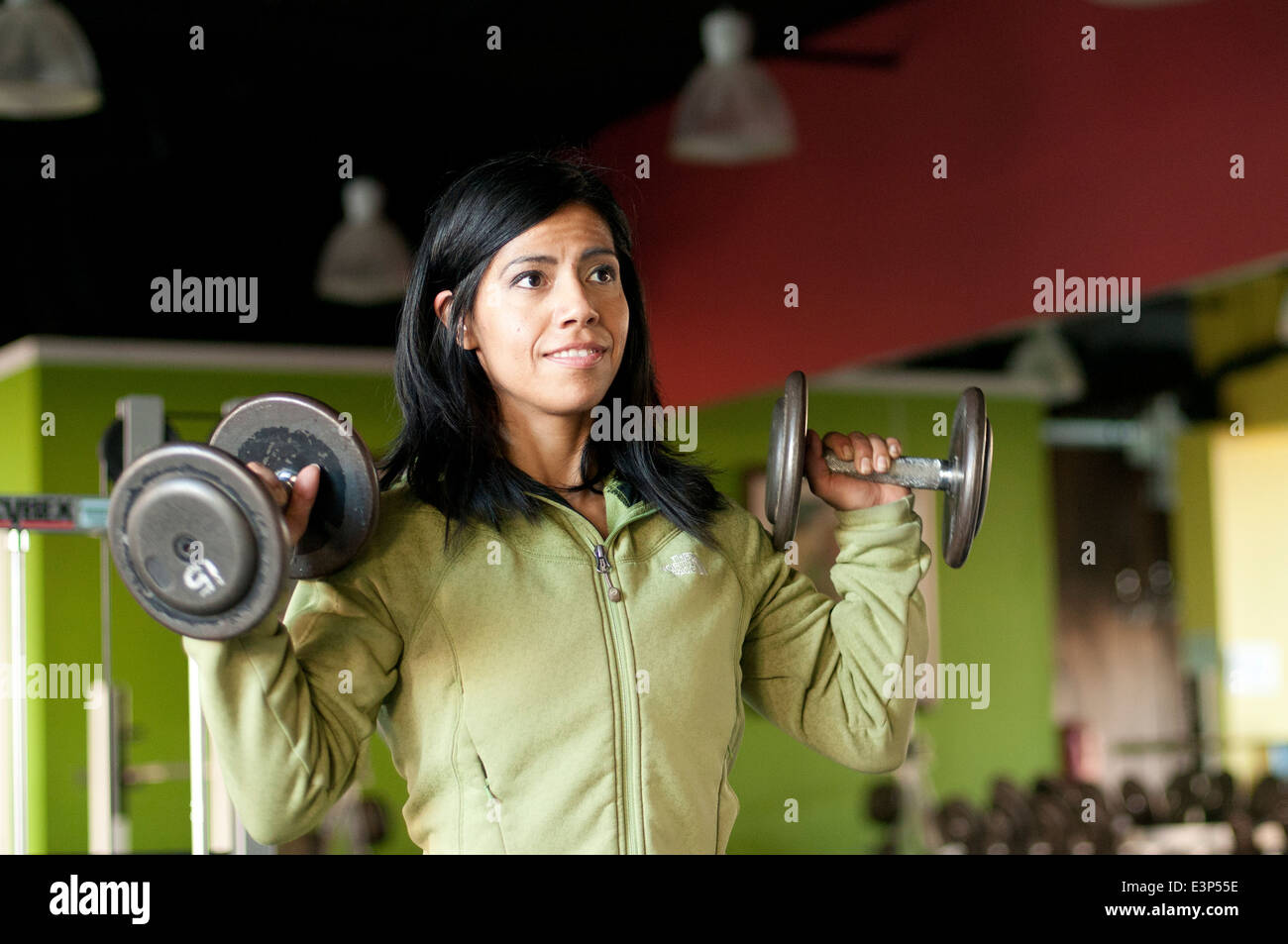 Seattle. Latina woman working out in gym. (MR Stock Photo - Alamy