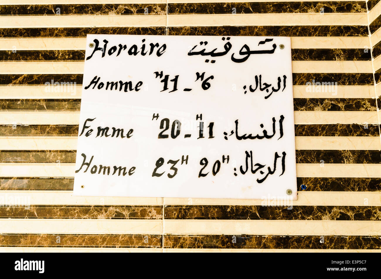 Hand written opening hours timetable in Arabic and French for men and ...