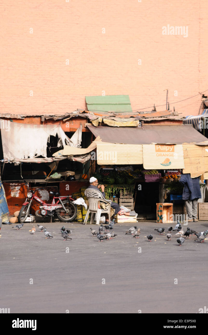 Shopkeeper sitting outside his shop in Marrakech, Morocco Stock Photo ...
