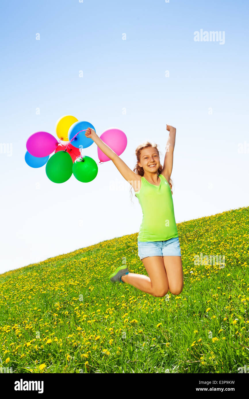 Children jumping in air in park hi-res stock photography and images - Alamy