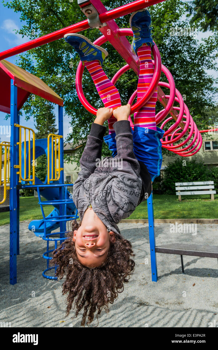 Young boy on playground bars Stock Photo - Alamy