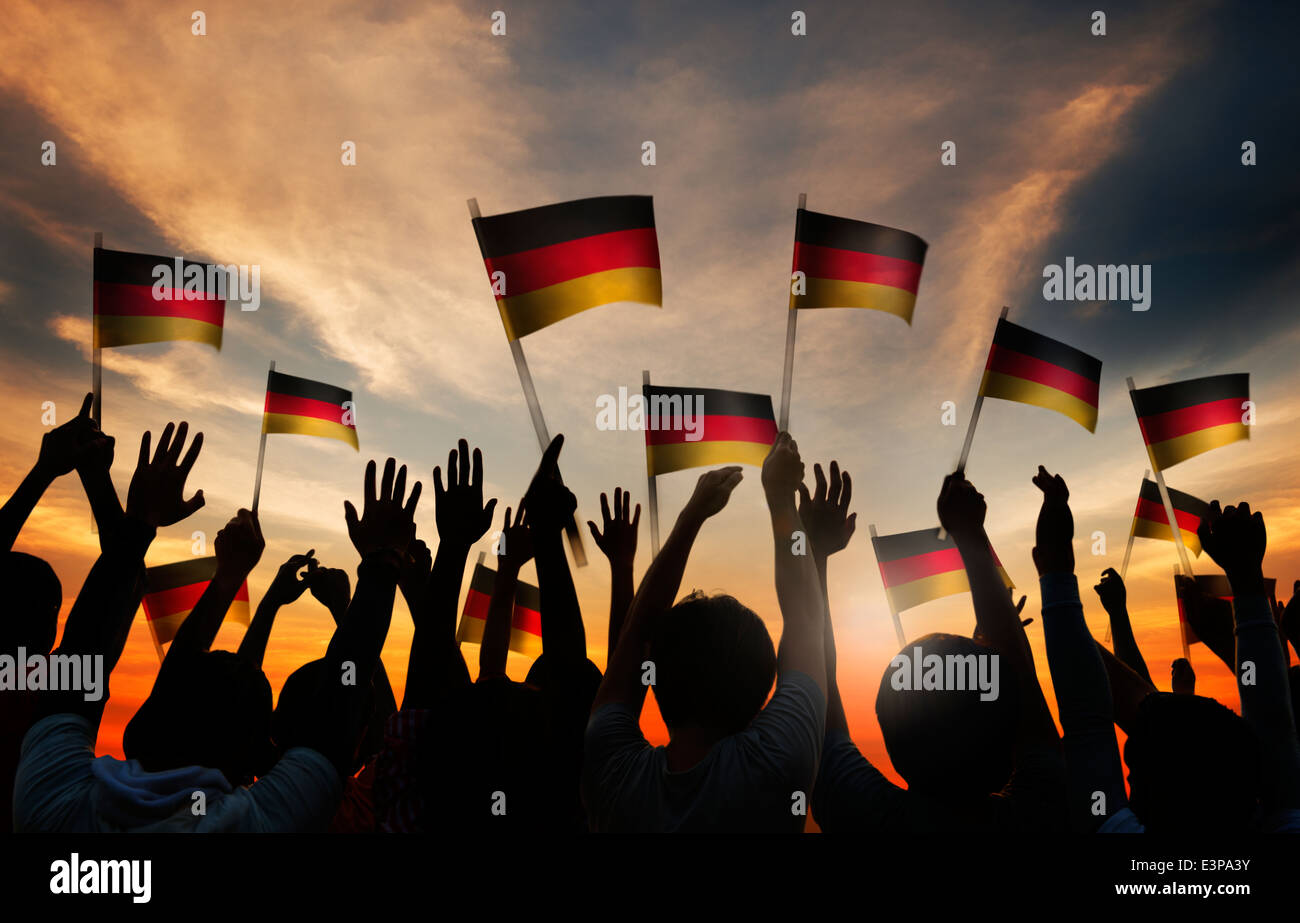 Silhouettes of People Holding the Flag of Germany Stock Photo - Alamy
