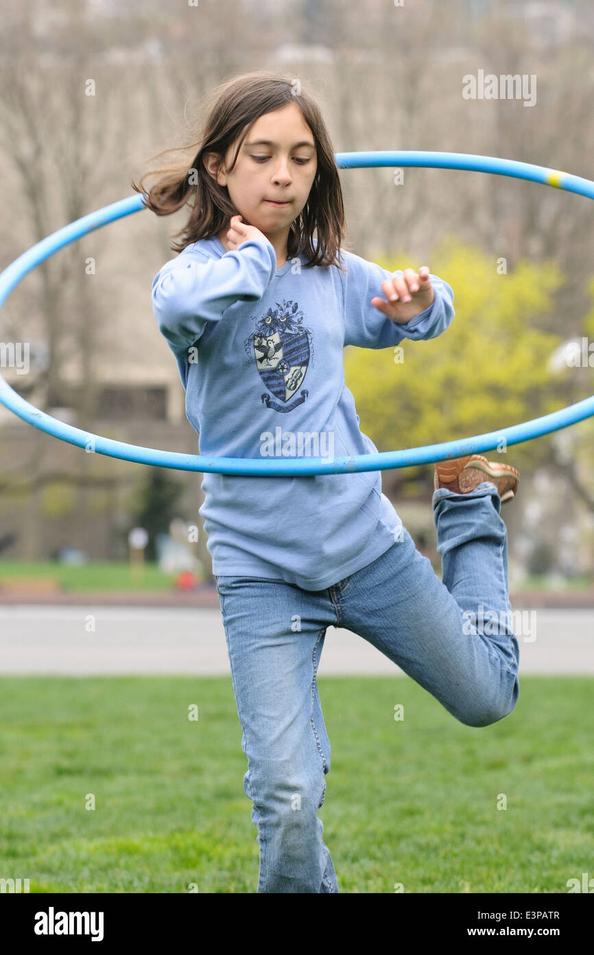 Girl with hula hoop Stock Photo - Alamy