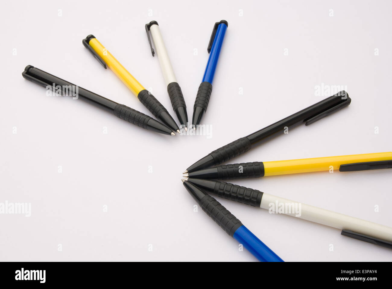 different color ball pens on white Stock Photo - Alamy