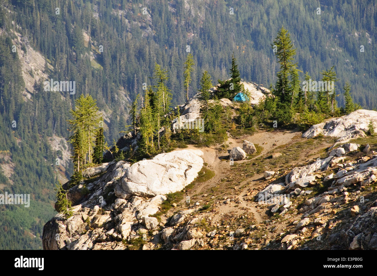 Washington State, North Cascades. Tent on outcropping, below Spider Gap ...