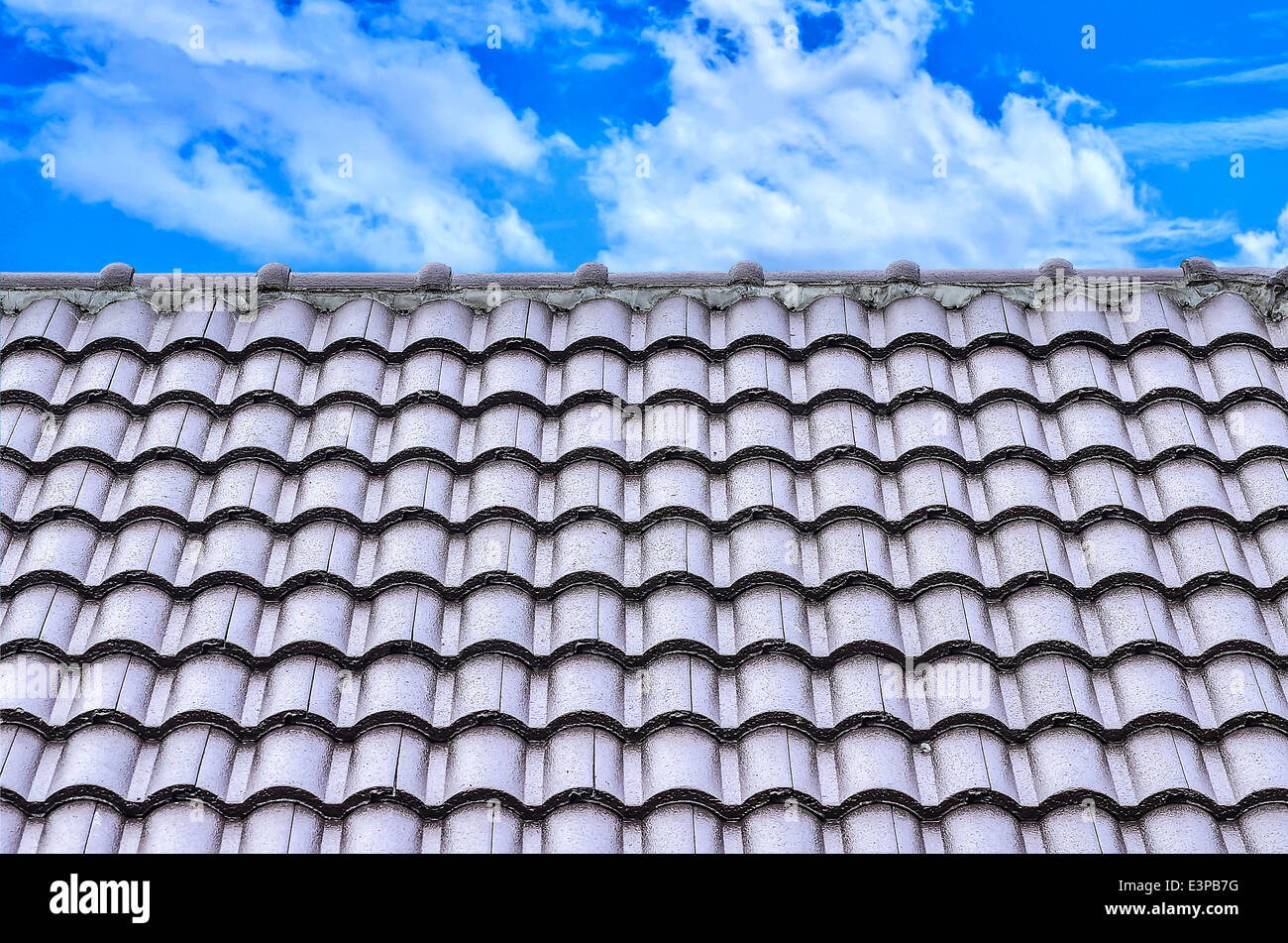 clay tiles roof pattern on blue sky background Stock Photo - Alamy