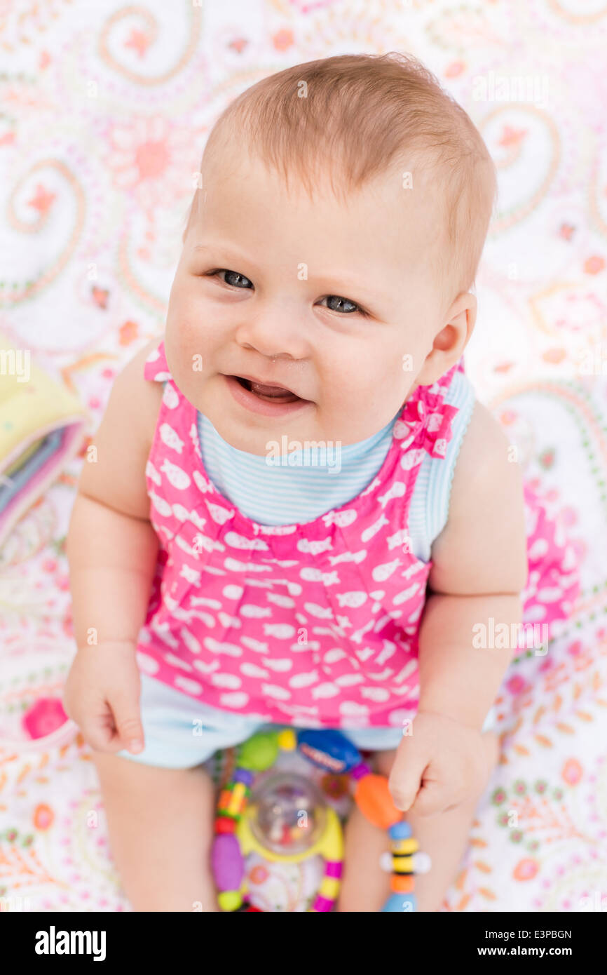 Cute baby girl playing on the blinket in the park Stock Photo - Alamy