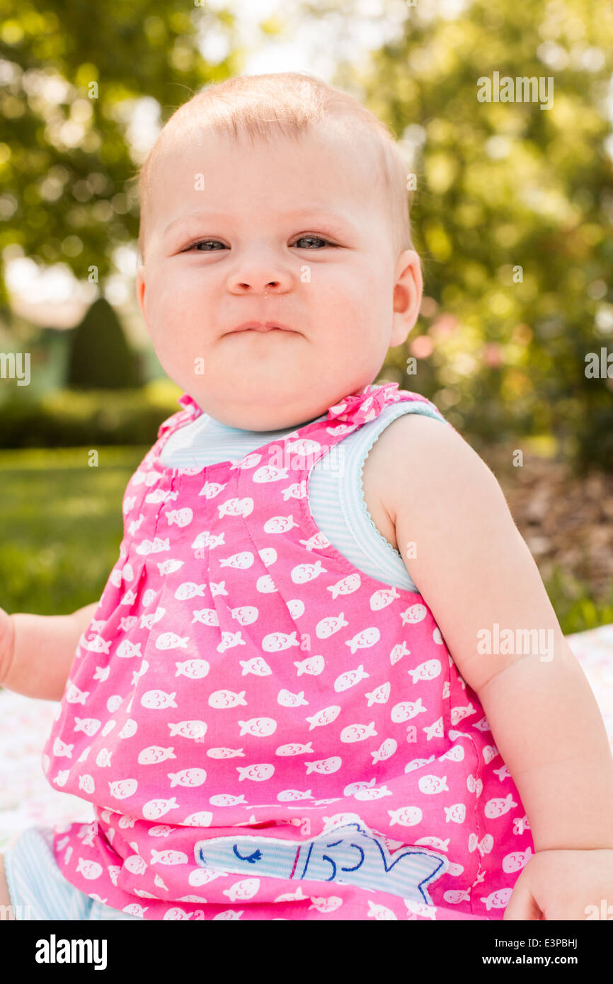 Cute baby girl playing on the blinket in the park Stock Photo - Alamy