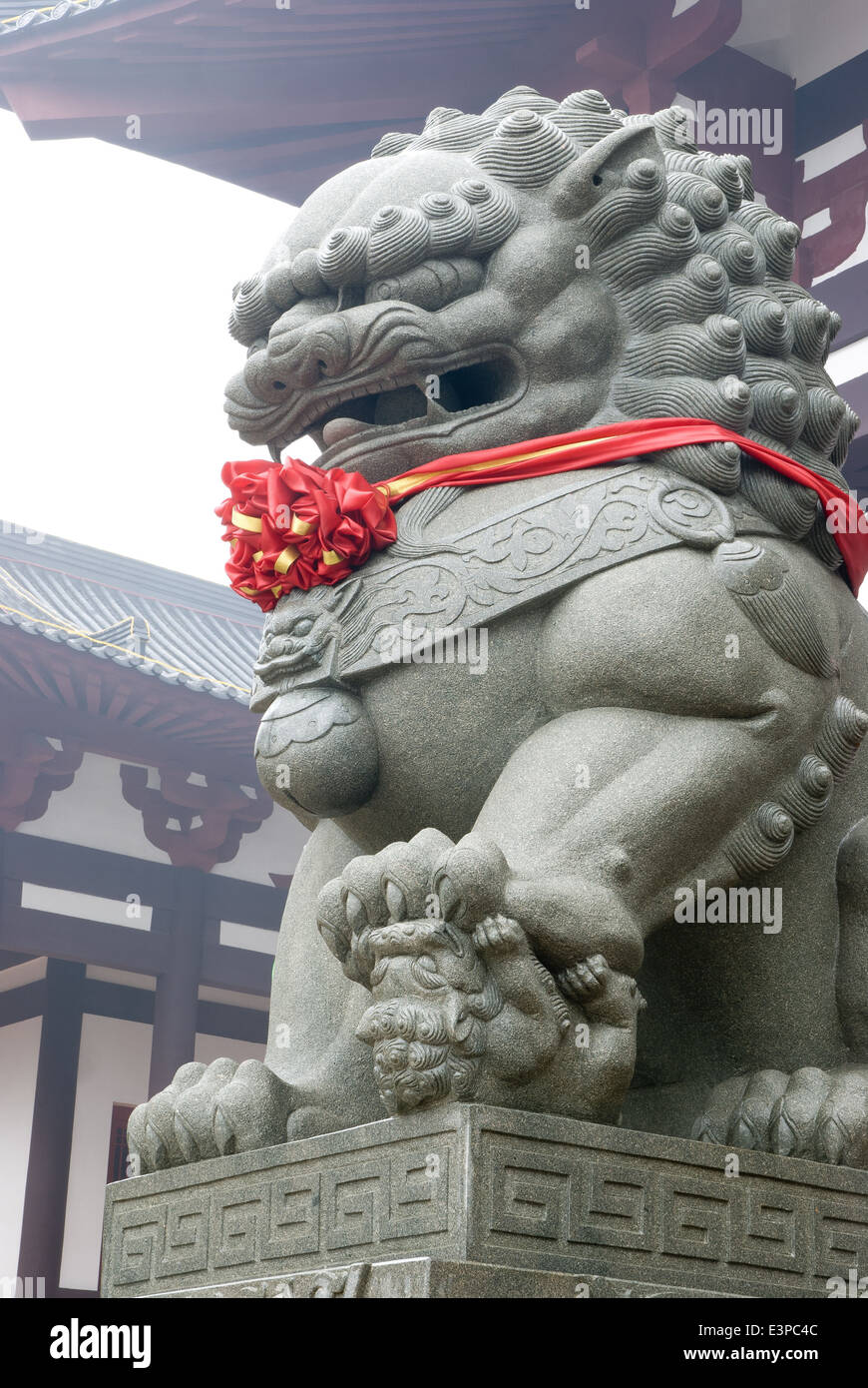 fengshui lion with red ribbon Stock Photo - Alamy