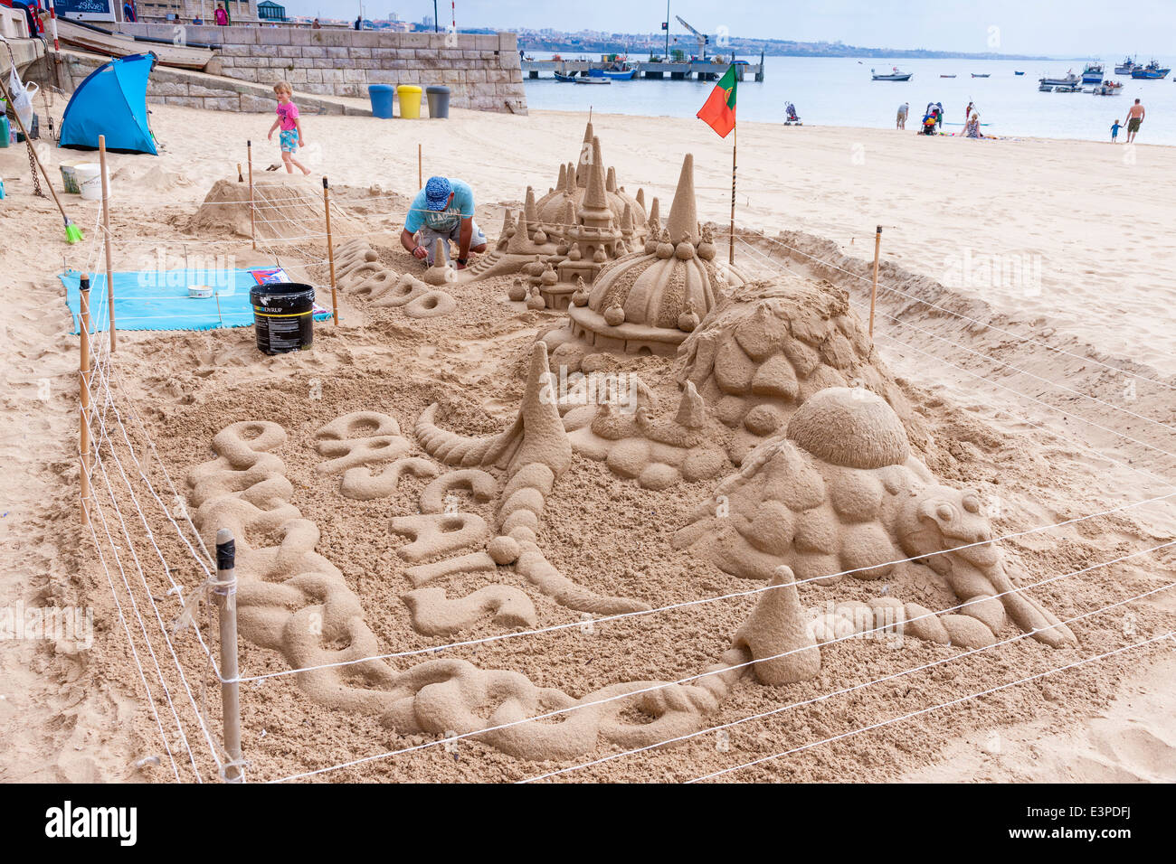 Man building sandcastle on the beach hi-res stock photography and ...