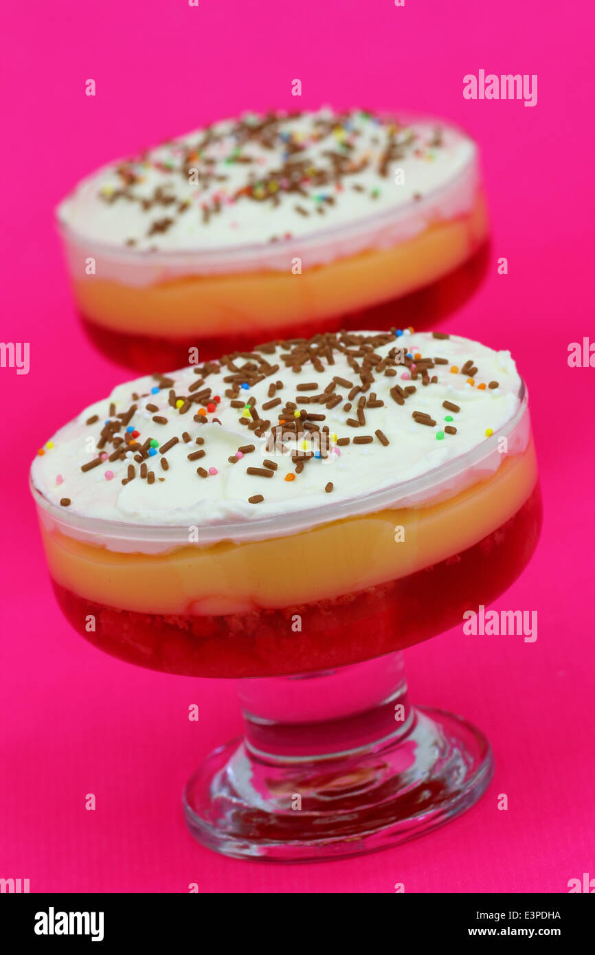 Strawberry trifle on pink background Stock Photo - Alamy