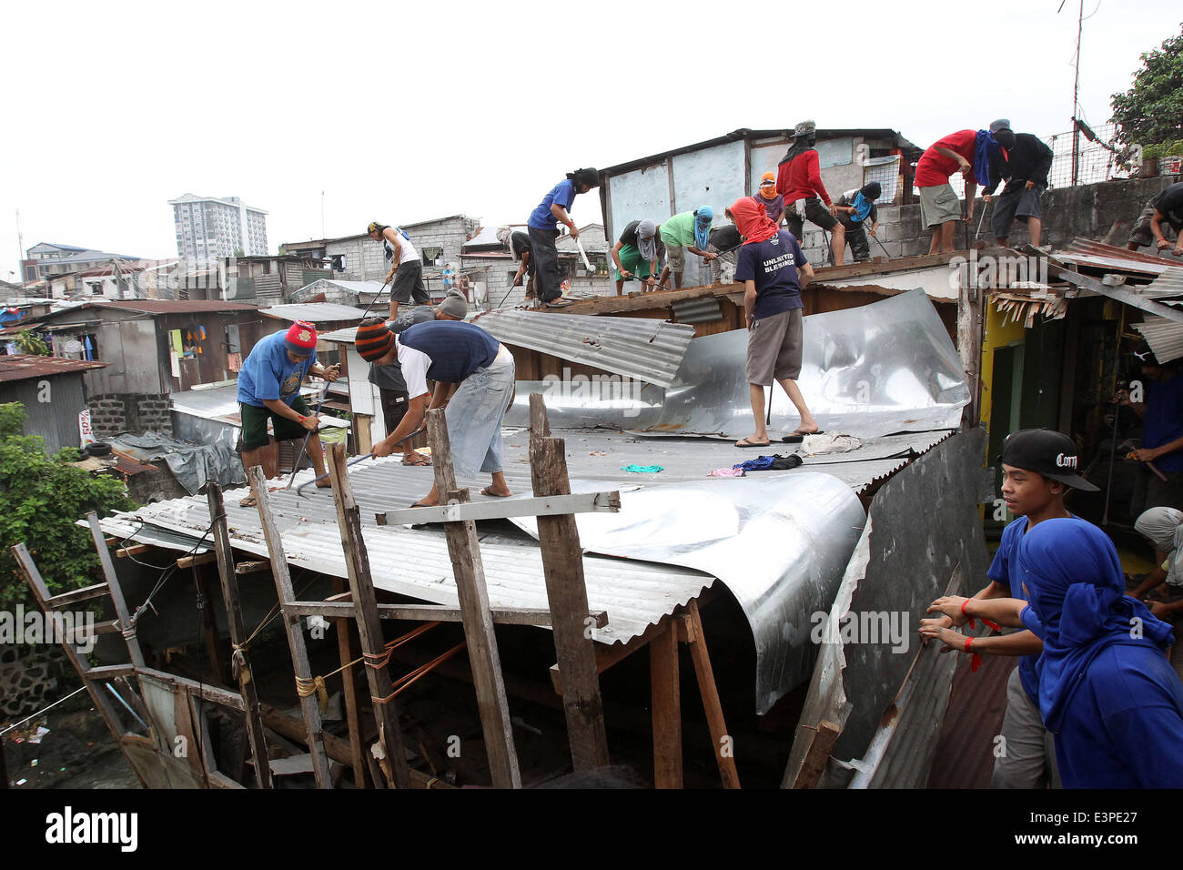 Quezon City, Philippines. 26th June, 2014. Demolition team members ...