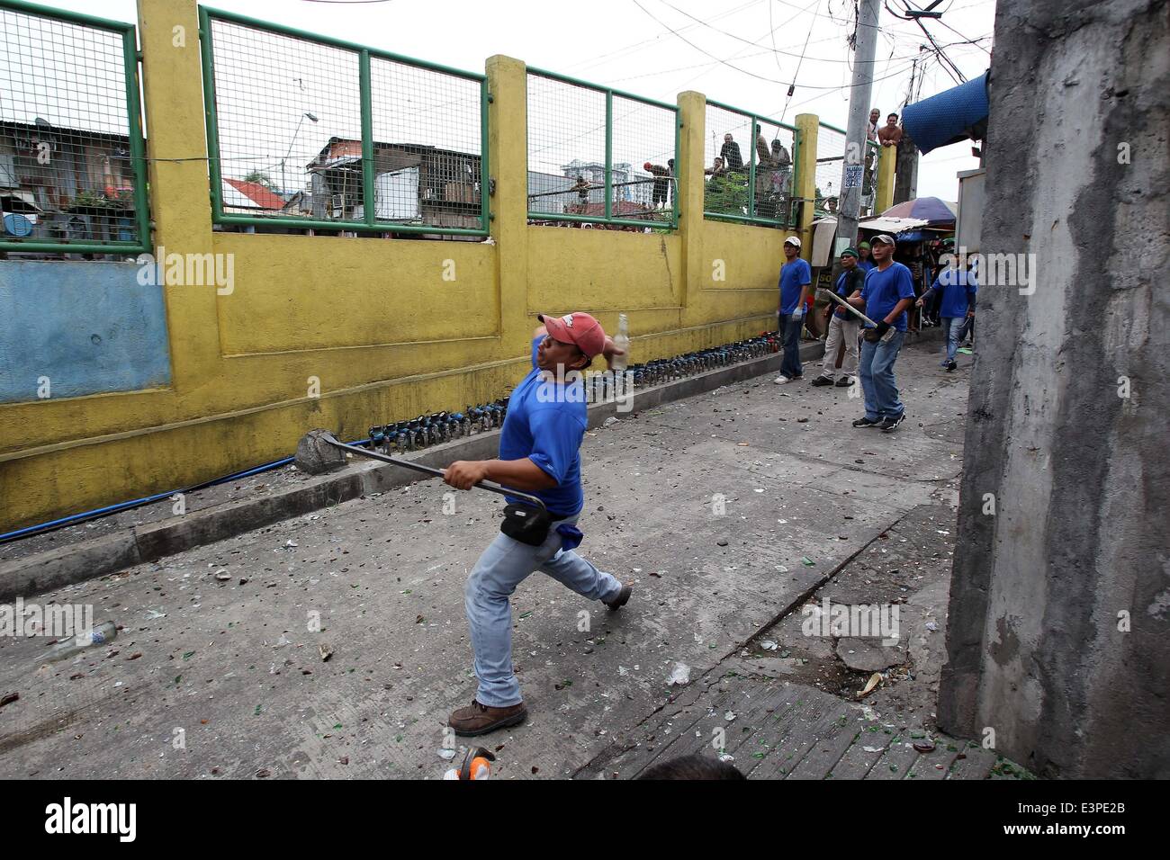 Quezon City, Philippines. 26th June, 2014. A member of a demolition ...