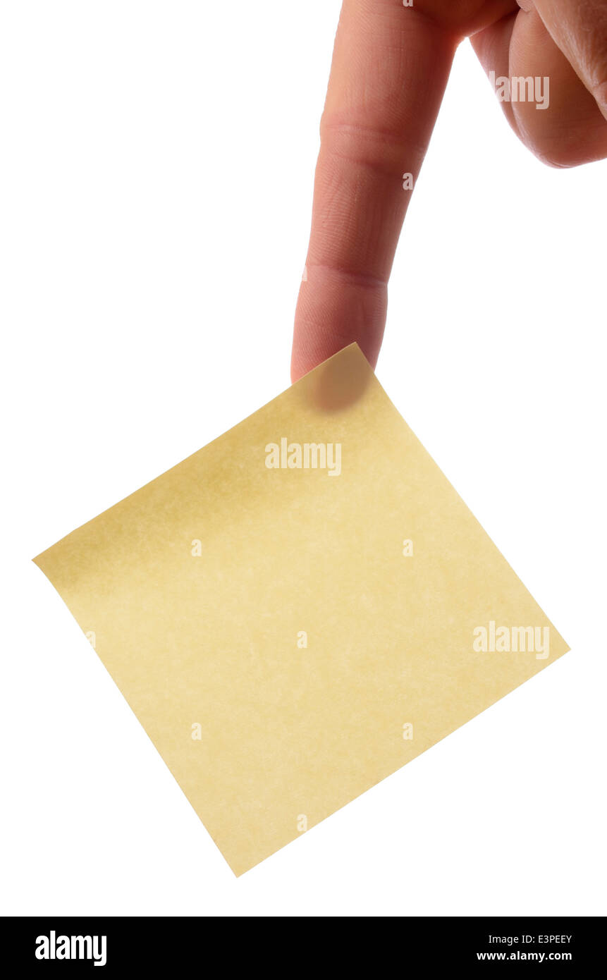 Hand holding a yellow sticky note Stock Photo - Alamy