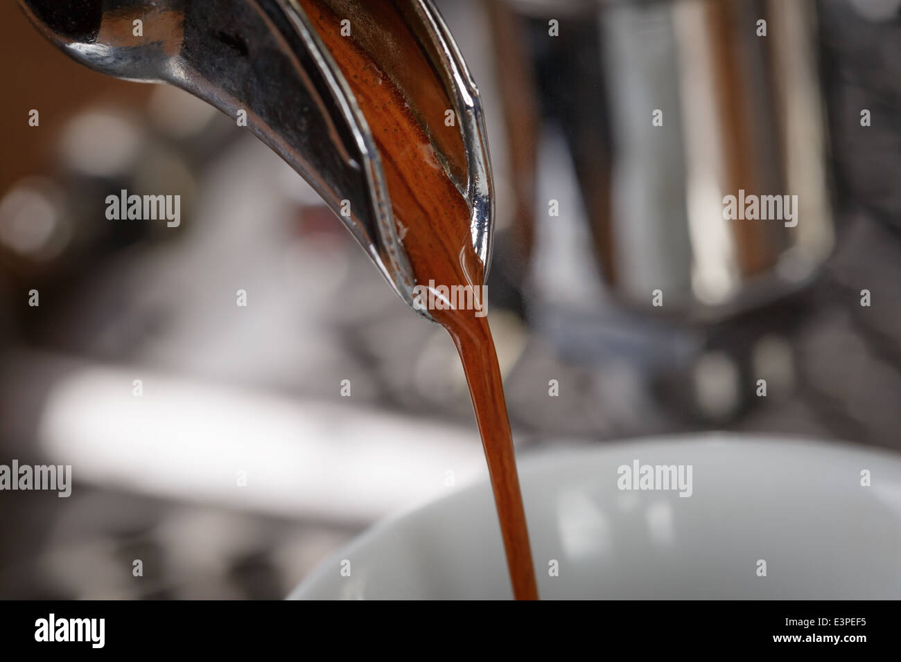 coffee extraction process from professional espresso machine, close up ...