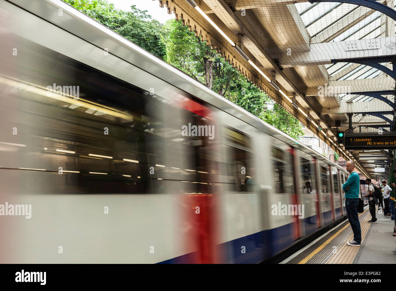 Train Entering Station Stock Photo - Alamy