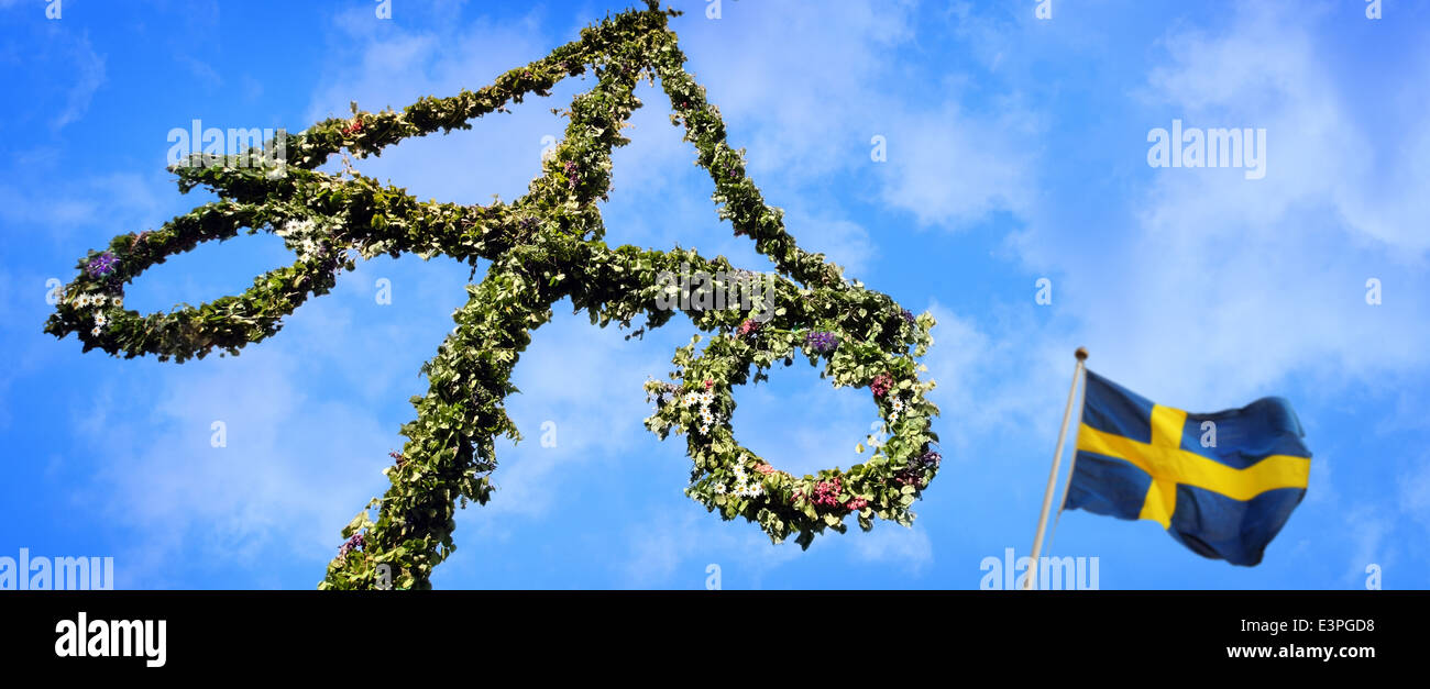 Maypole decorated with Swedish flag Stock Photo - Alamy