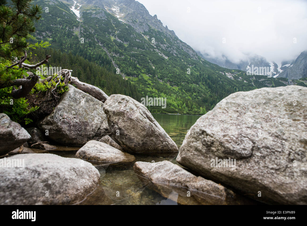 Rocks, lake and mountains Stock Photo - Alamy