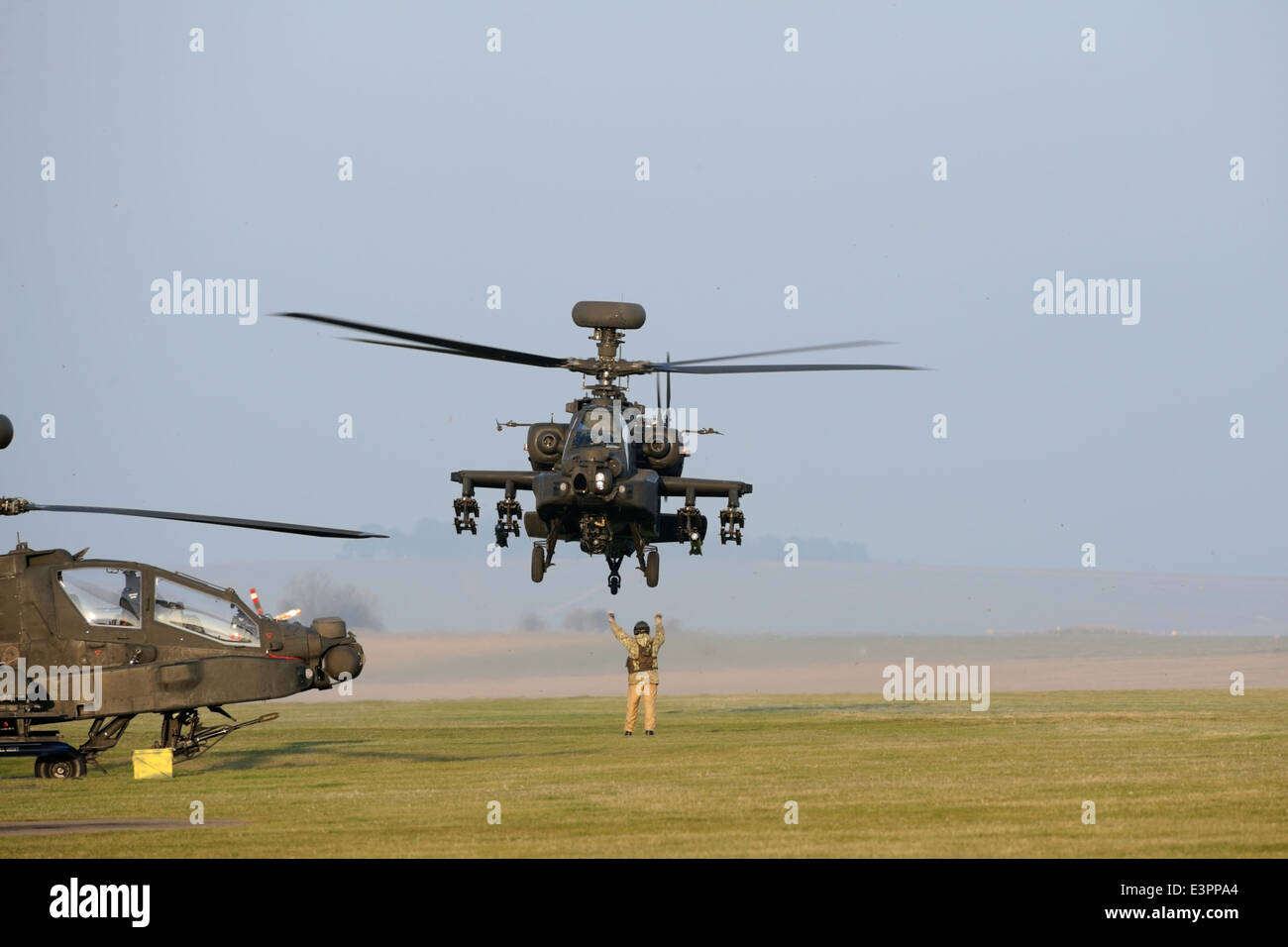 British Army AH-64 marshalled to dispersal at Airfield Camp, Netheravon ...