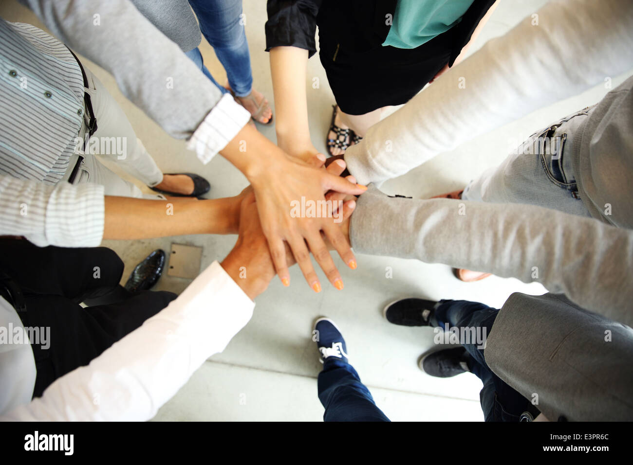 Business people joining hands Stock Photo - Alamy
