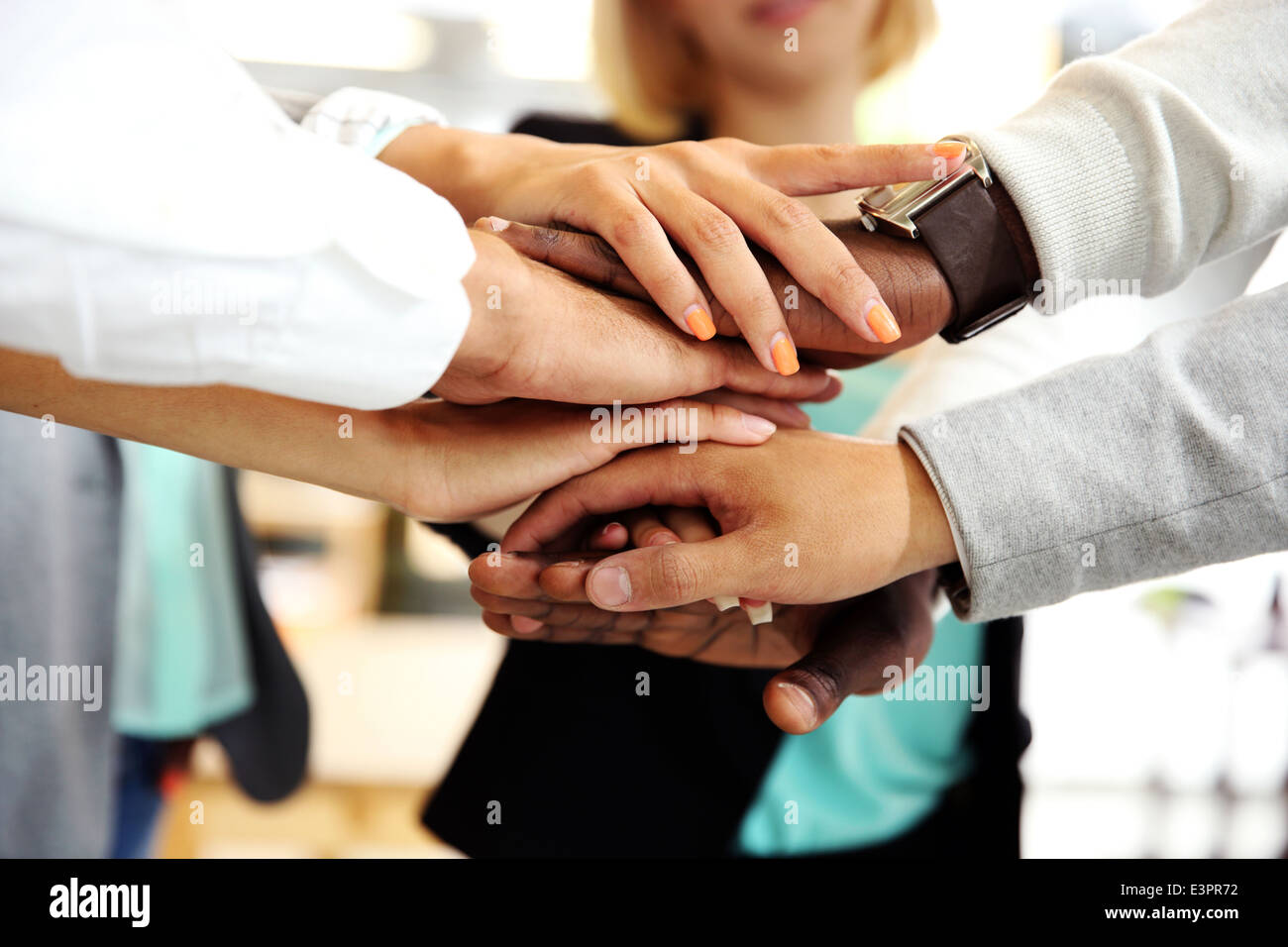 Business people joining hands Stock Photo - Alamy