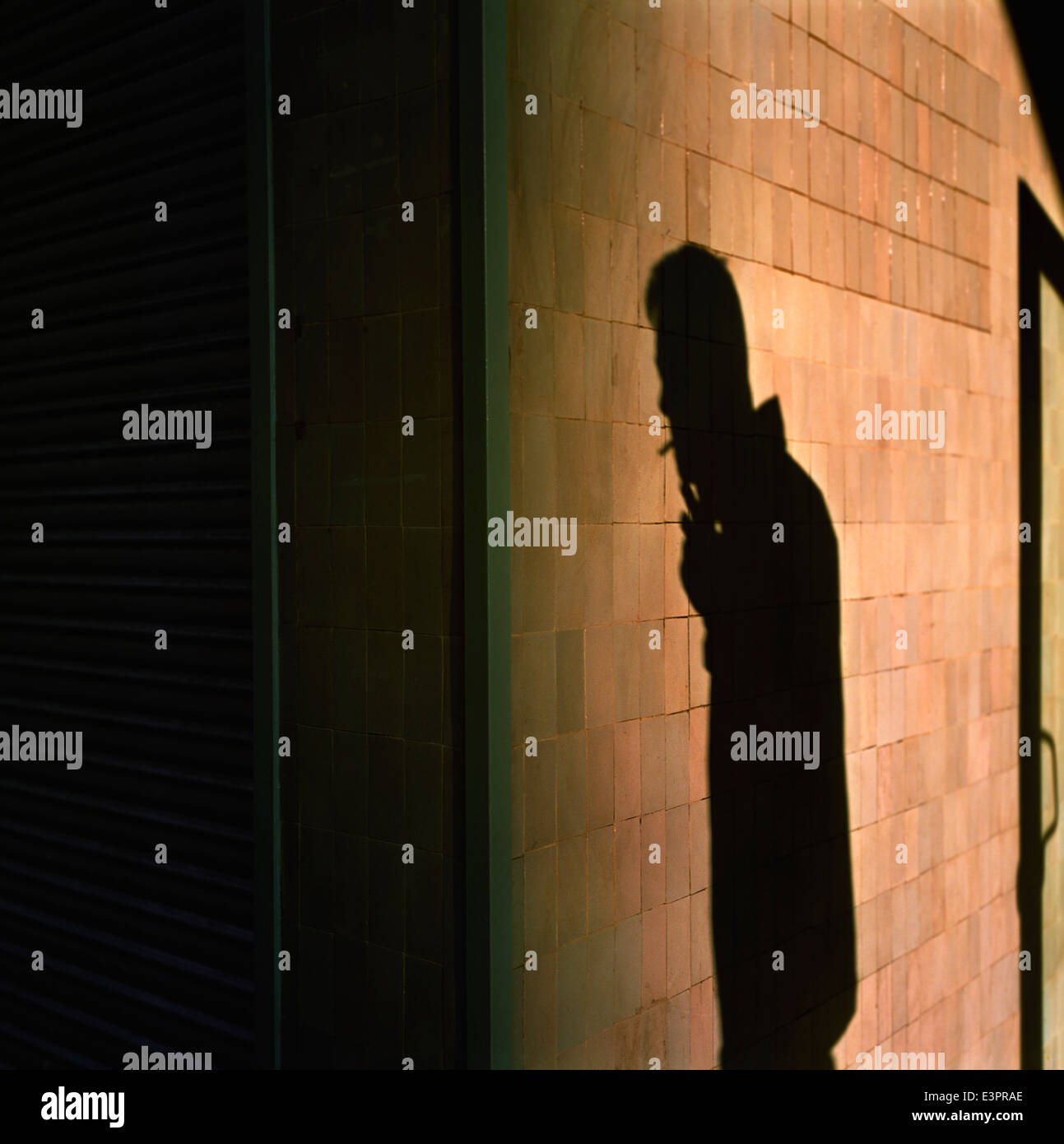 Shadow of bank customer leaving bank - Barcelona Stock Photo - Alamy