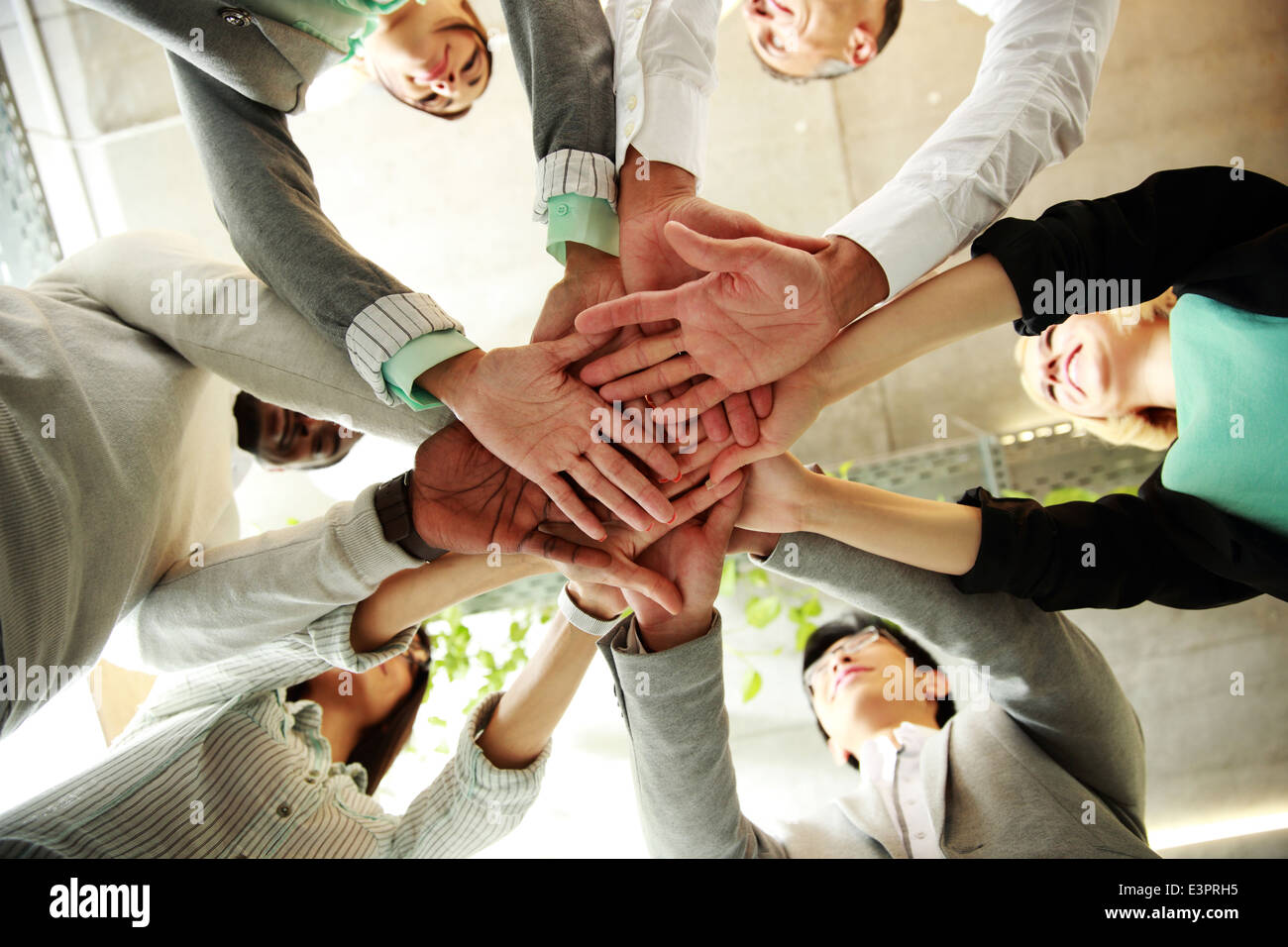 business people teamwork in an office with hands together Stock Photo ...