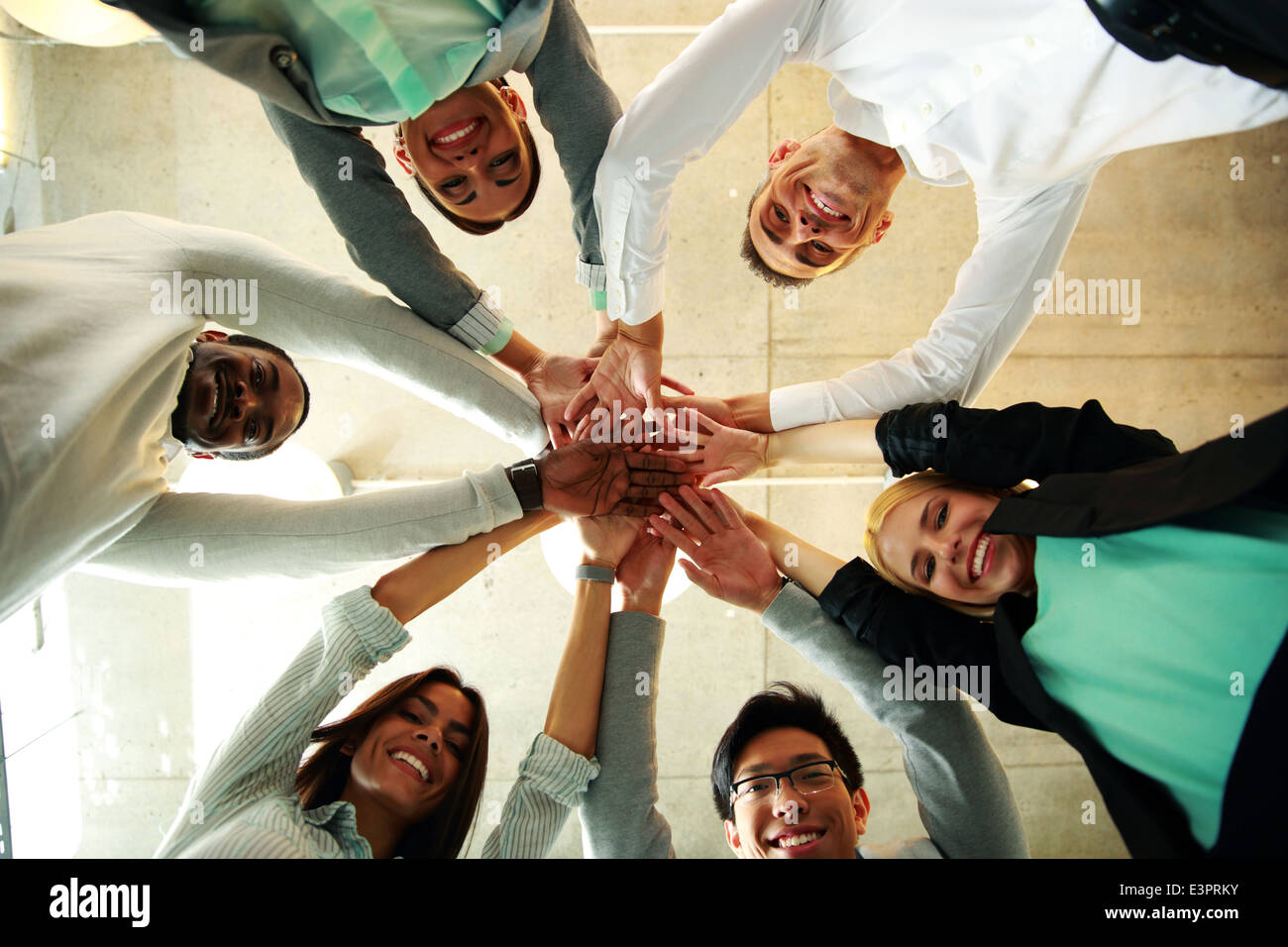 business people teamwork in an office with hands together Stock Photo ...