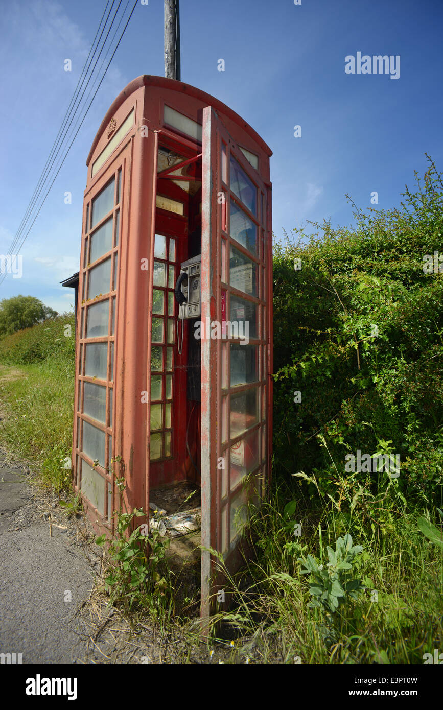 overgrown telephone box united kingdom Stock Photo - Alamy