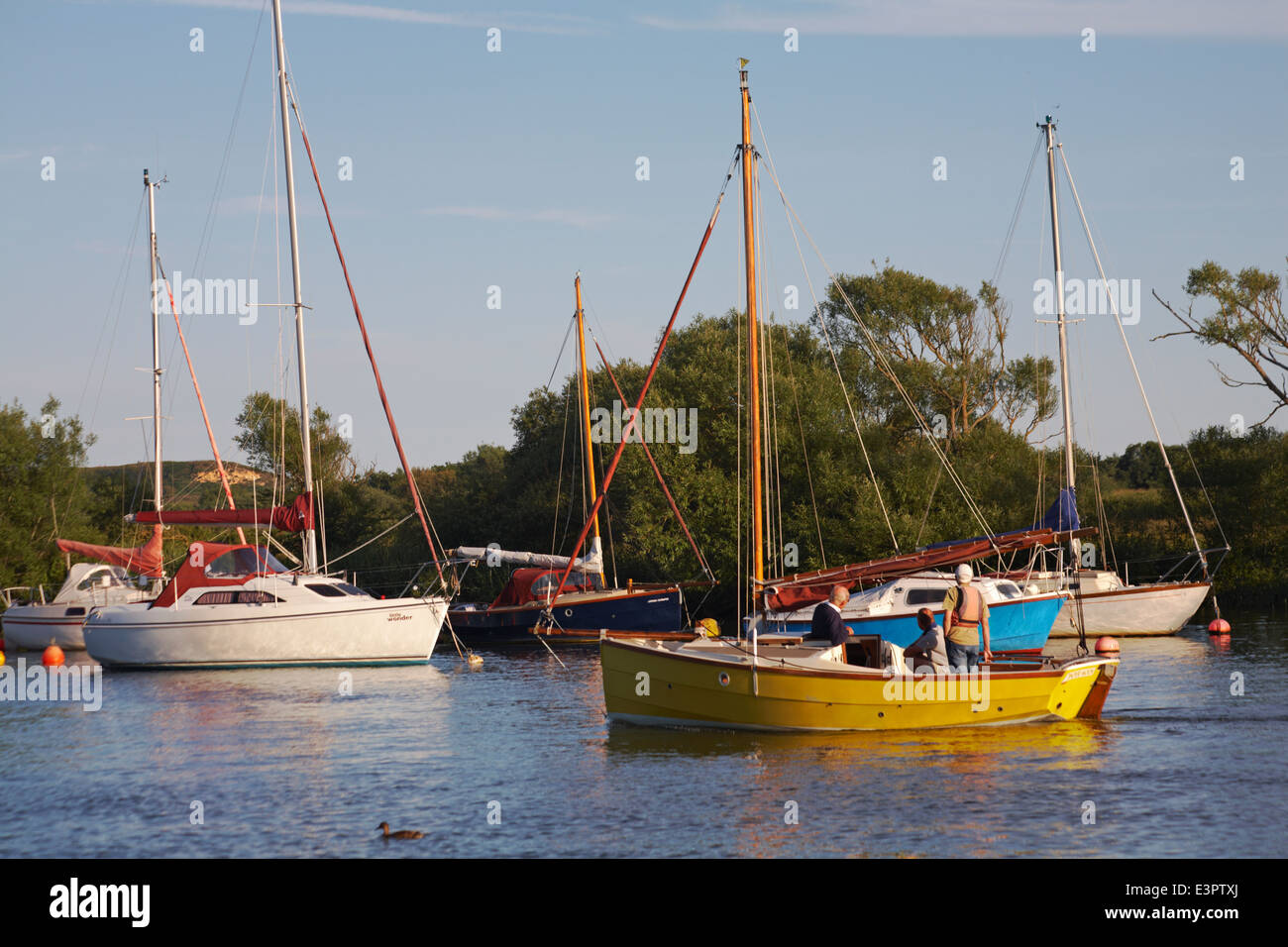 Boats moored on the River Stour at Christchurch Town Quay, Dorset, UK ...