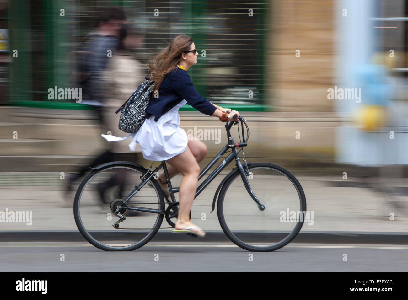 Lady on bicycle in the University city of Oxford, Oxfordshire, England ...