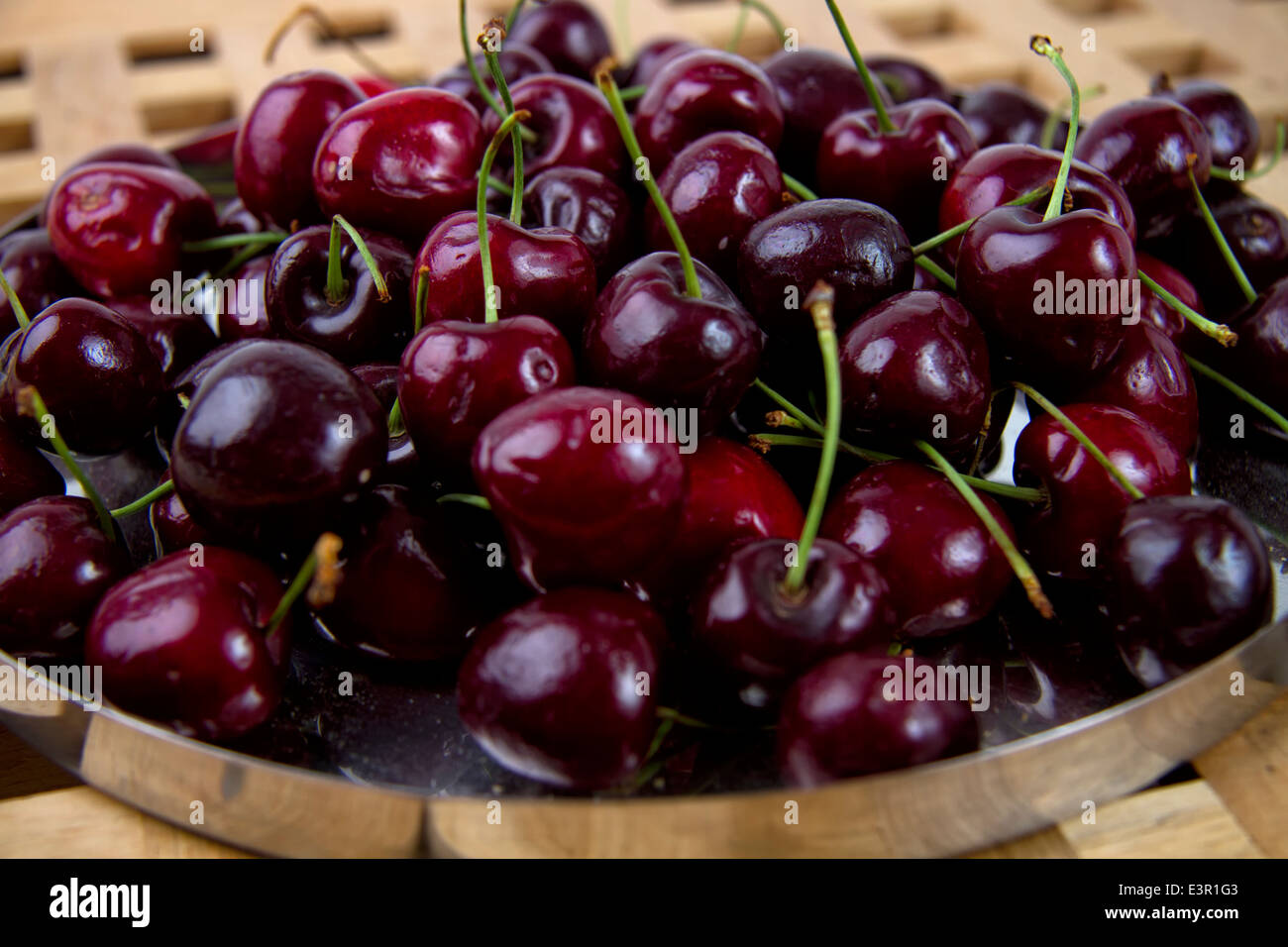 Dish of black cherries Stock Photo - Alamy