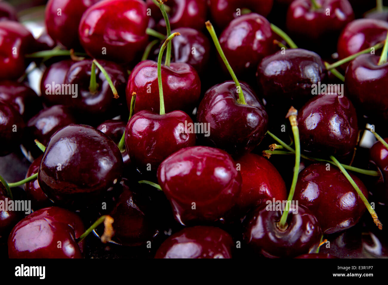 Dish of black cherries Stock Photo - Alamy